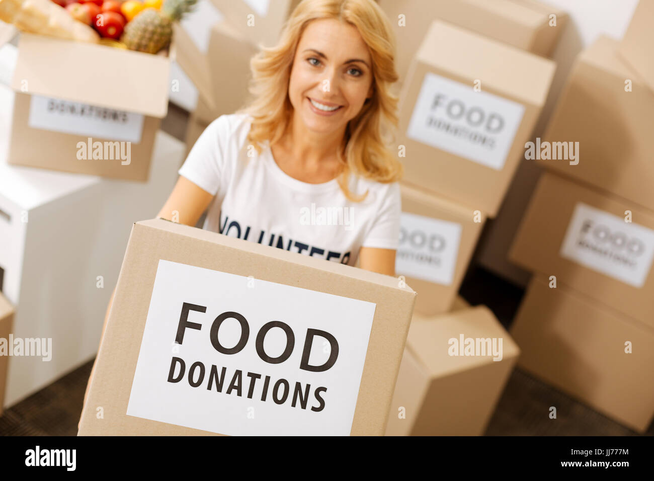 Altruistic energetic woman excited working for people Stock Photo - Alamy