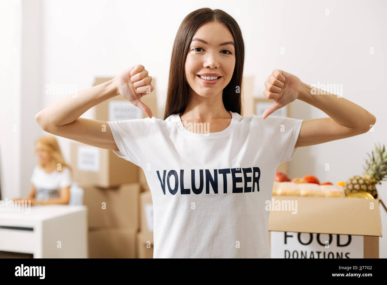 Cute hardworking woman proud helping people Stock Photo - Alamy