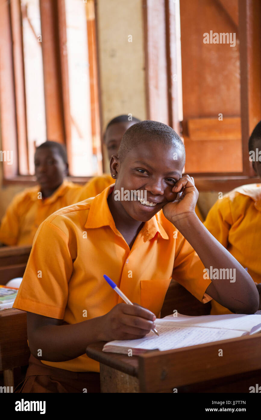 A portrait of a school girl smiling in the classroom Stock Photo - Alamy