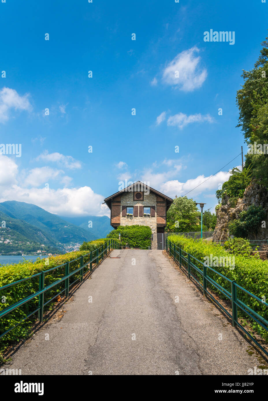 Alps style house next to Lake Como, Italy on a beautiful summer day ...