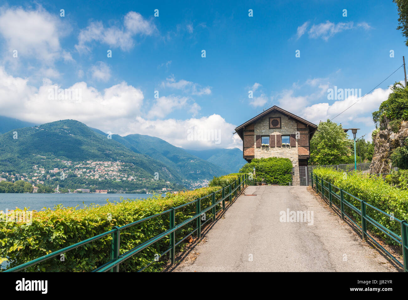 Alps style house next to Lake Como, Italy on a beautiful summer day ...