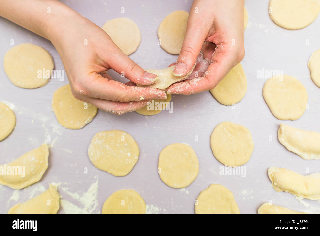 Woman hand's make ravioli Stock Photo - Alamy