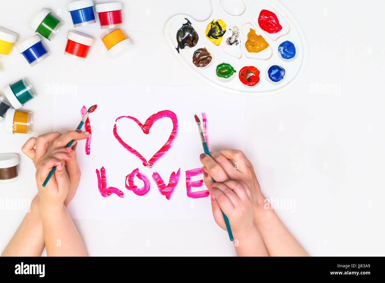 Child's hands painting a heart Stock Photo - Alamy