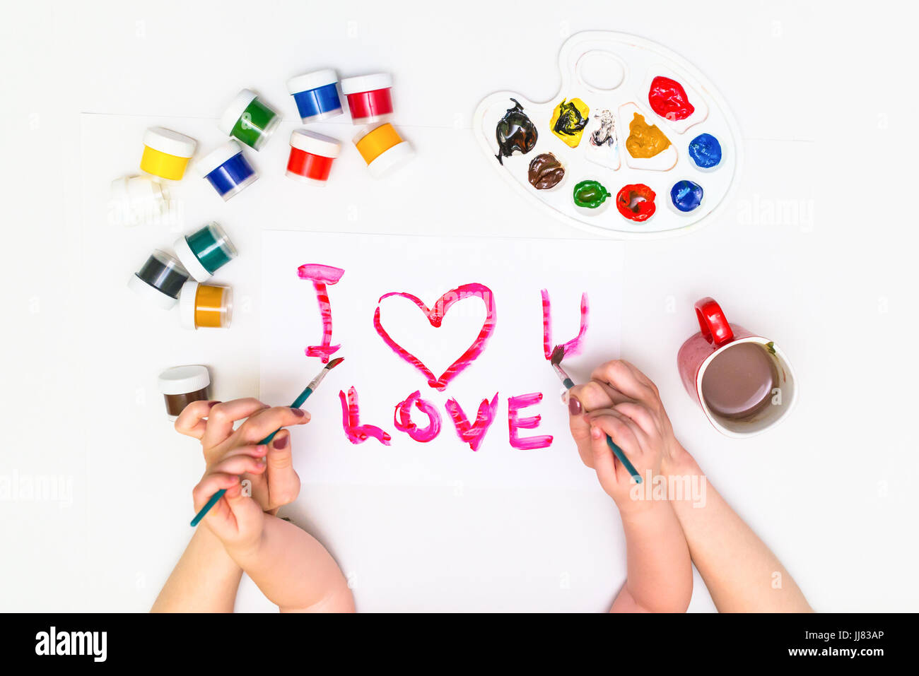Child's hands painting a heart Stock Photo - Alamy