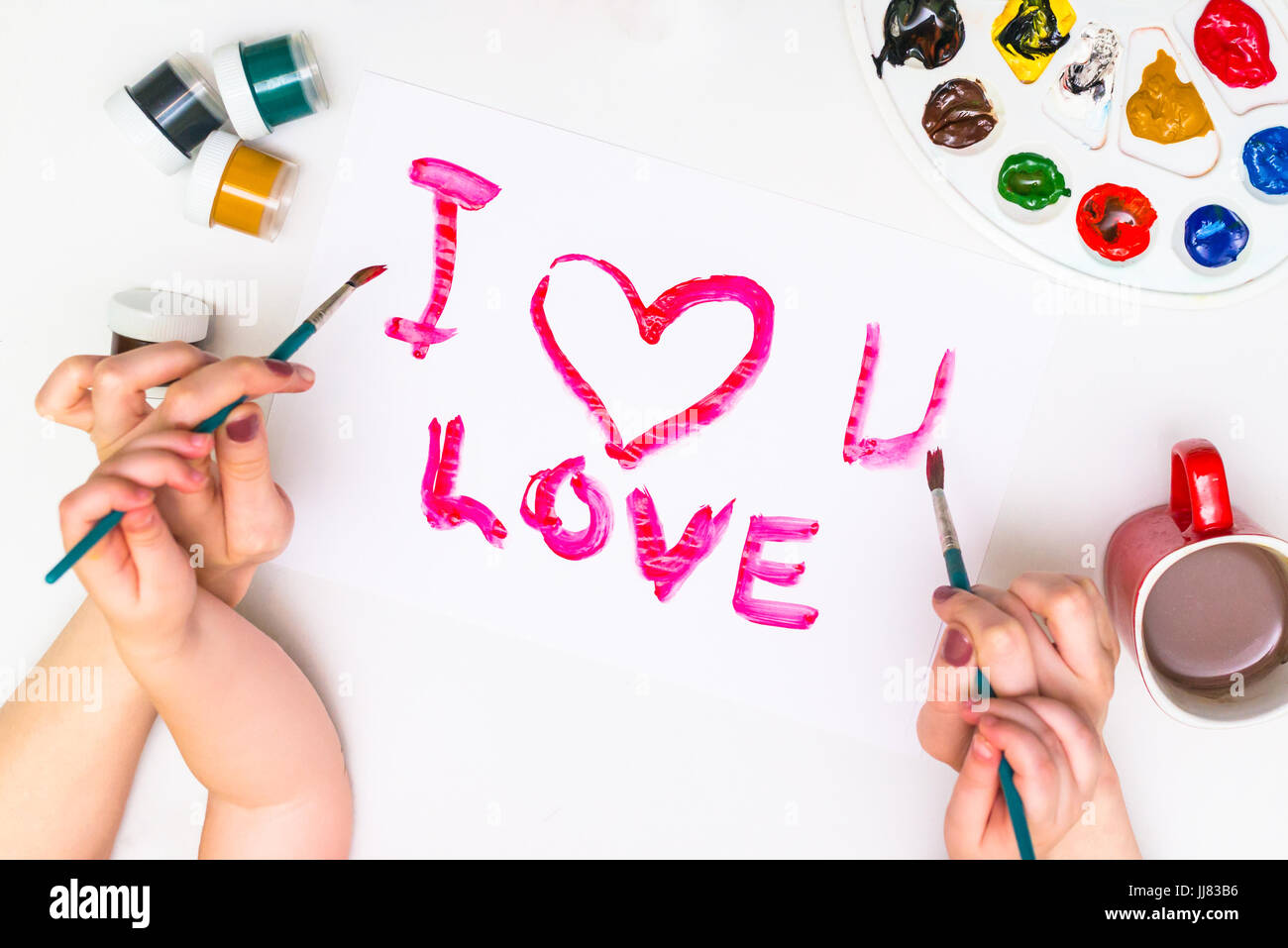 Child's hands painting a heart Stock Photo - Alamy