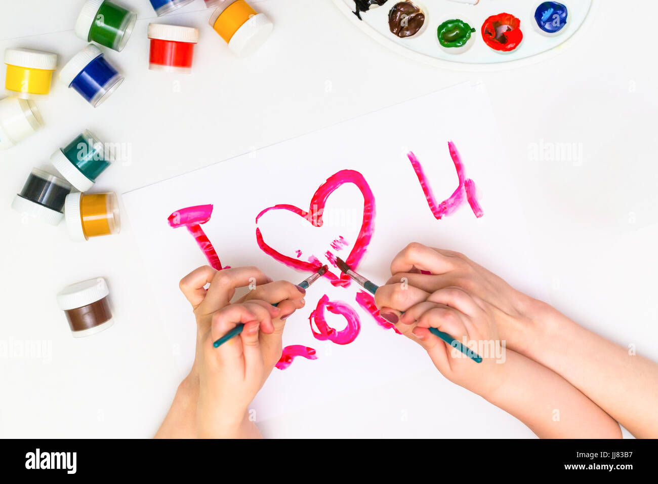 Child's hands painting a heart Stock Photo - Alamy