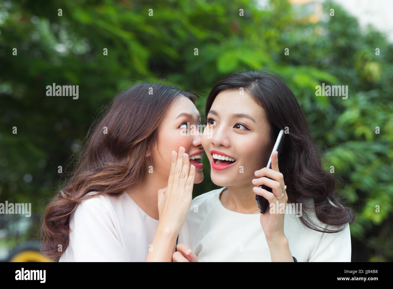 Indian woman whispering hi-res stock photography and images - Alamy