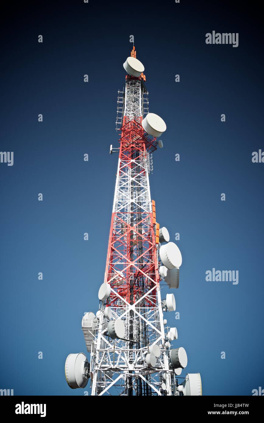 Telecommunications tower with clear blue sky Stock Photo - Alamy