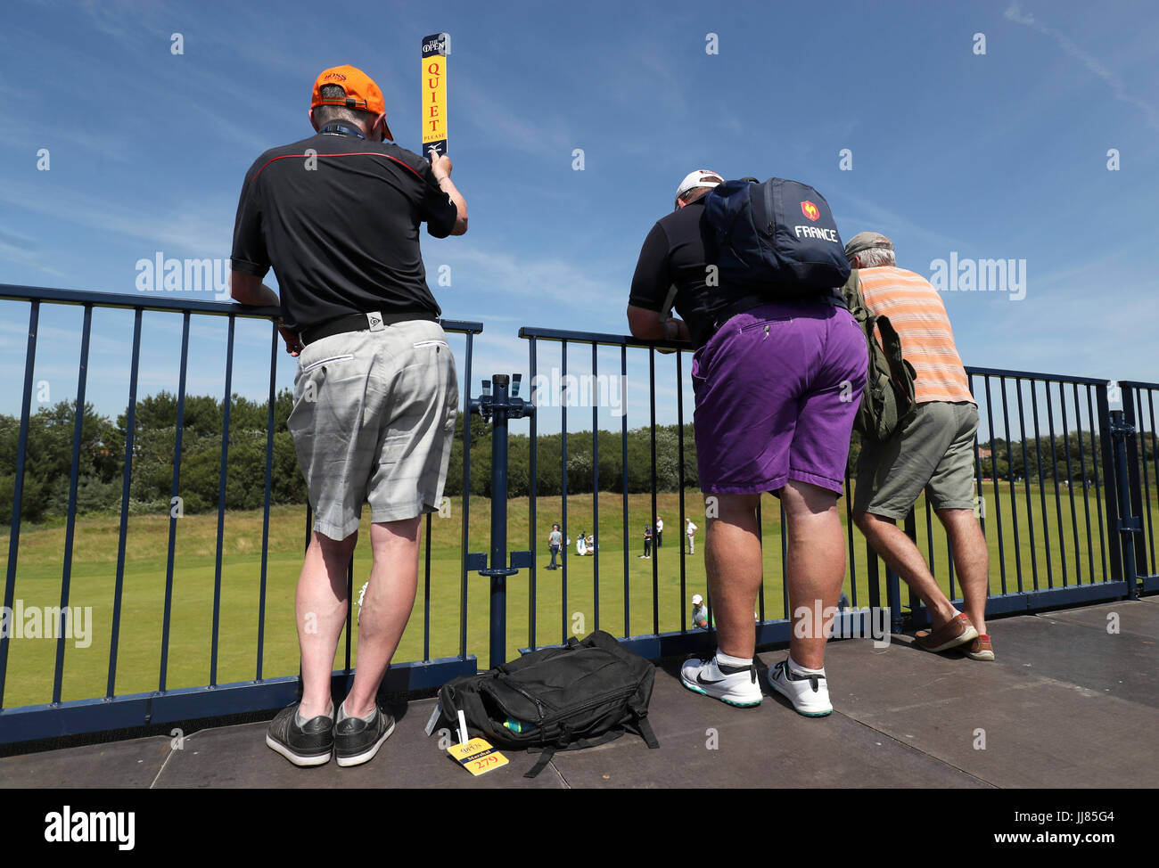 A Marshal raises the Quite Please sign in the grandstand during ...