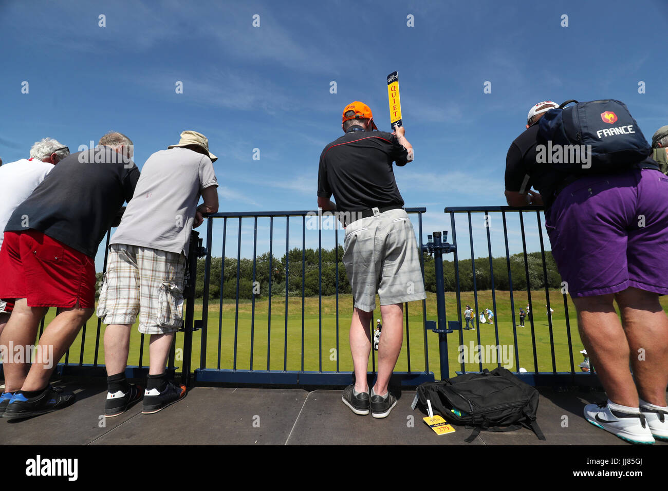 A Marshal raises the Quite Please sign in the grandstand during ...