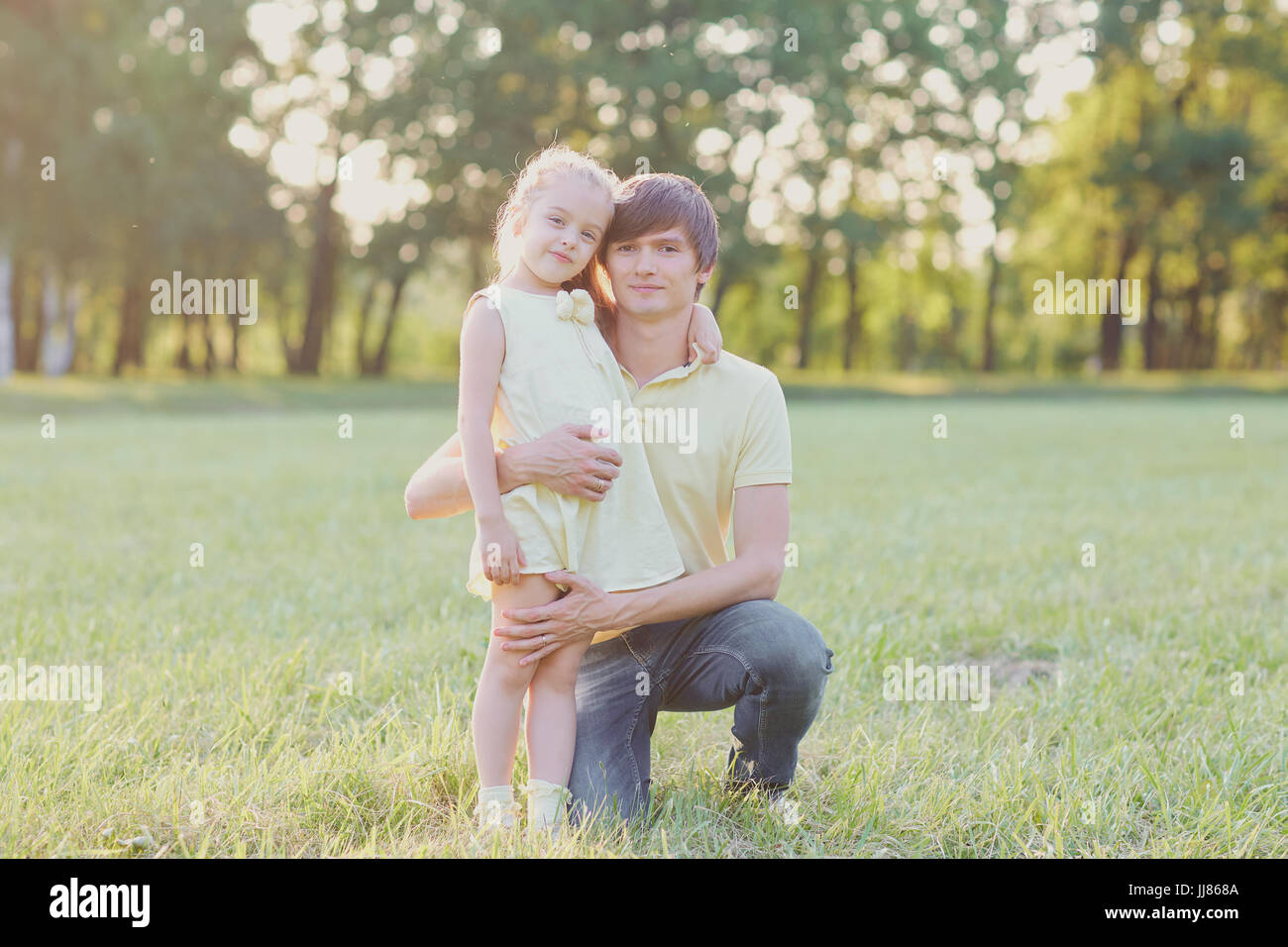 Father and daughter hugging in the park Stock Photo - Alamy