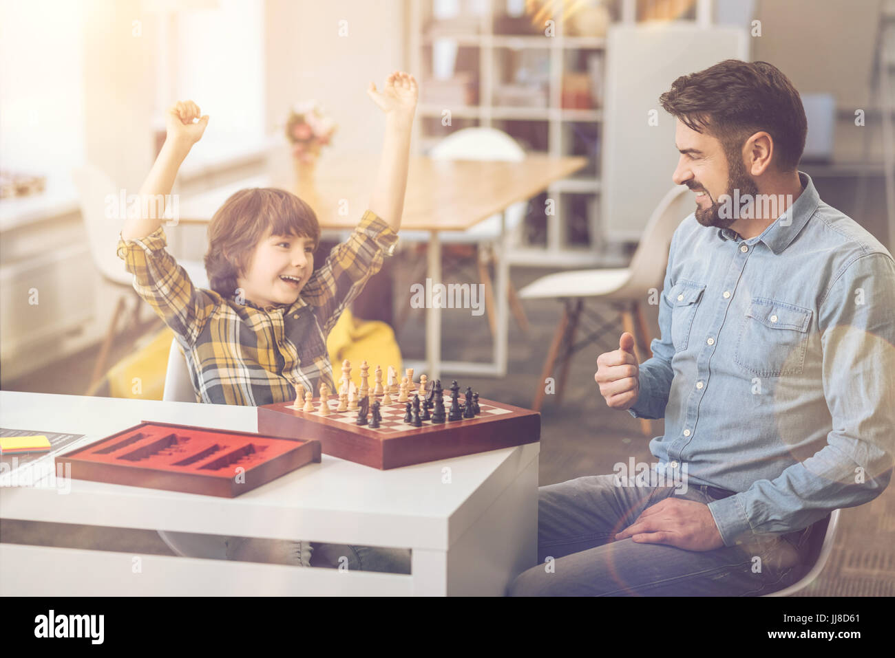 Cheerful delighted boy winning the chess game Stock Photo - Alamy