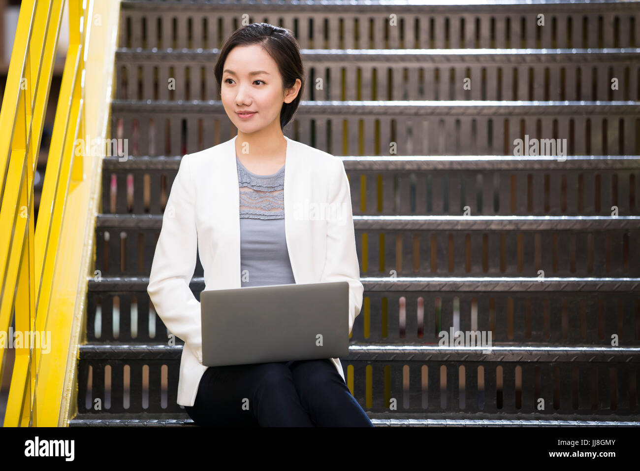 Business woman working on the stairs Stock Photo - Alamy
