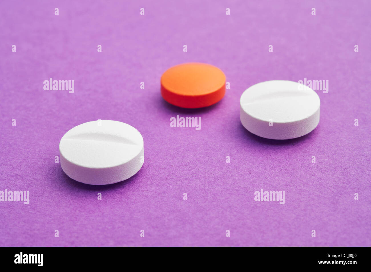Pills over a purple background. Medicament treatment. Health care photo ...