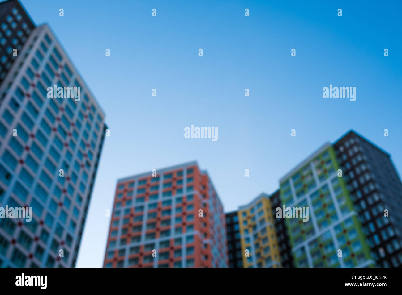 Abstract blurred buildings from below by looking up. Urban background ...
