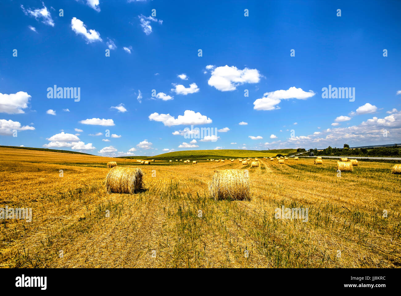 Round haystacks on the field after the harvest, Romania Stock Photo - Alamy