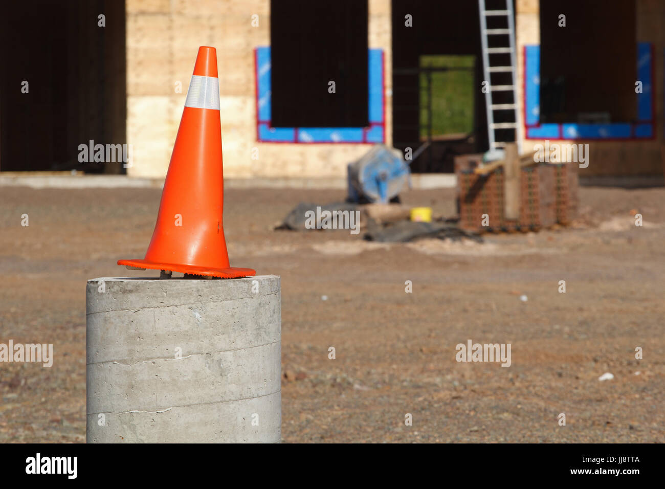 Saftey cone at construction site Stock Photo - Alamy