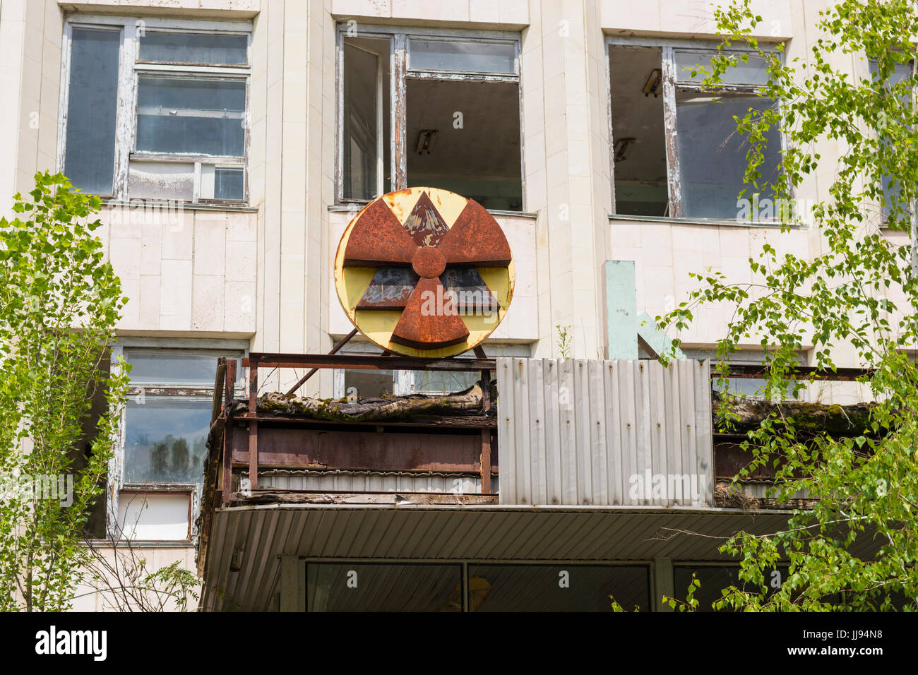Radiation sign on building facade in ghost city of Pripyat in Chernobyl ...