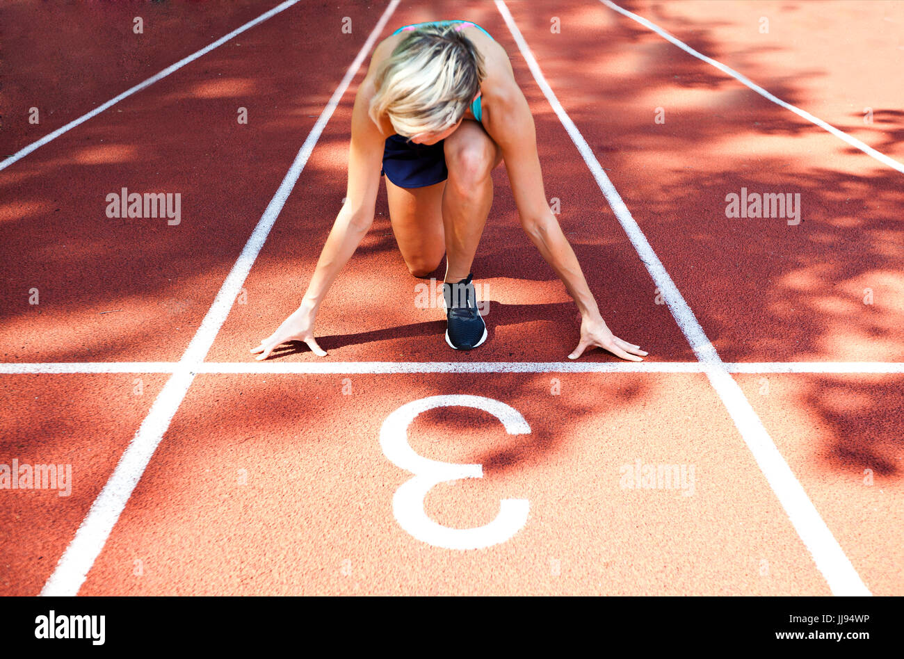 Running racer at finish line hi-res stock photography and images - Alamy
