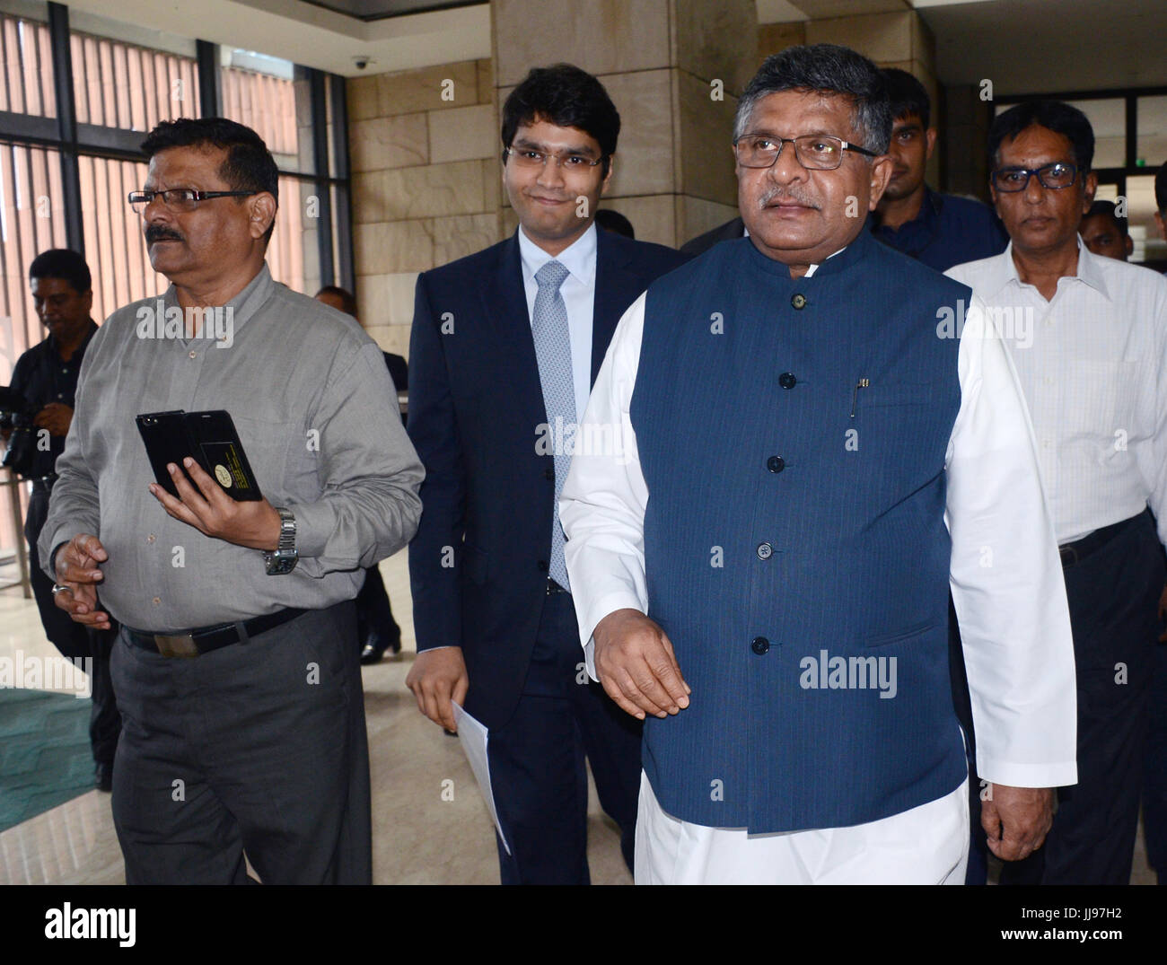 Kolkata, India. 18th July, 2017. Union Minister Ravi Shankar Prasad (right) entering to the ...