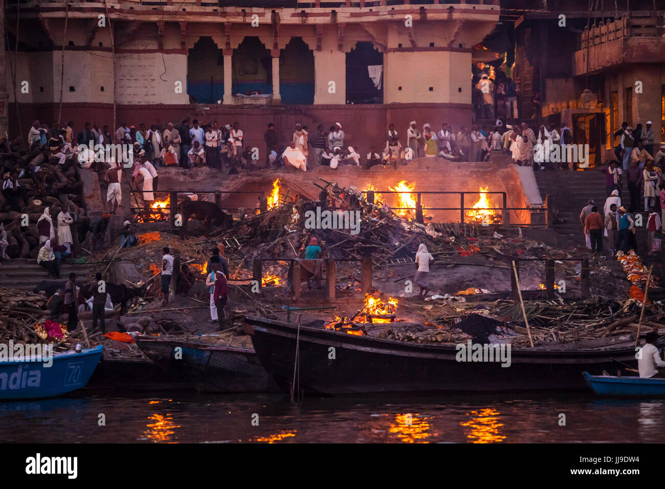 Cremation funeral pyres at early evening. Manikarnika Ghat, Varanasi ...