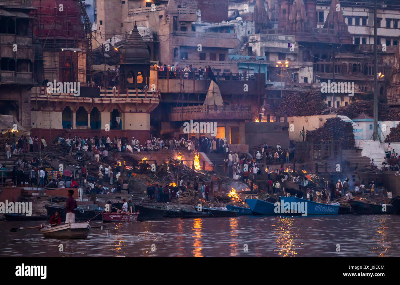 Cremation funeral pyres at early evening. Manikarnika Ghat, Varanasi ...