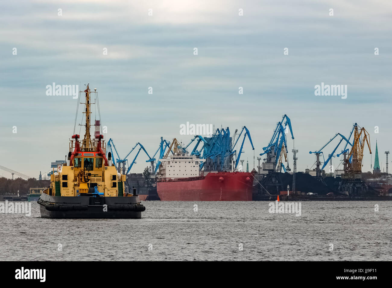 Tug ship in the cargo port of Riga, Europe Stock Photo - Alamy