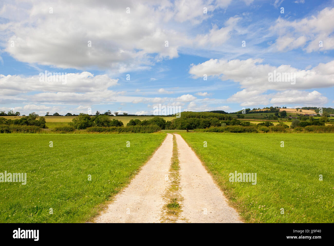 A limestone farm track with beautiful scenery and clocer fields in the ...
