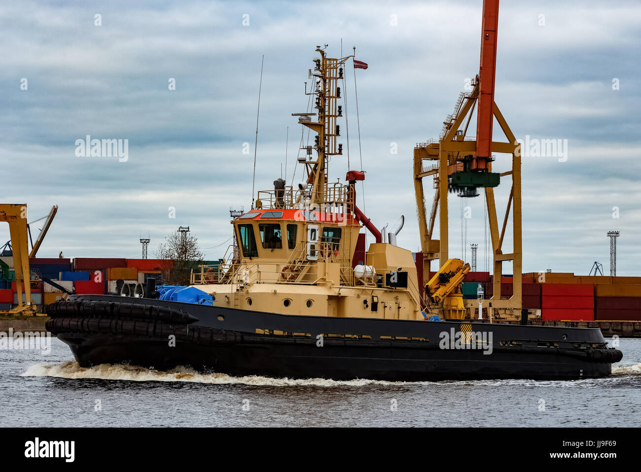 Tug ship in the cargo port of Riga, Europe Stock Photo - Alamy