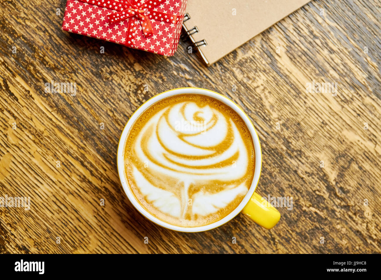 Latte art and gift box Stock Photo - Alamy