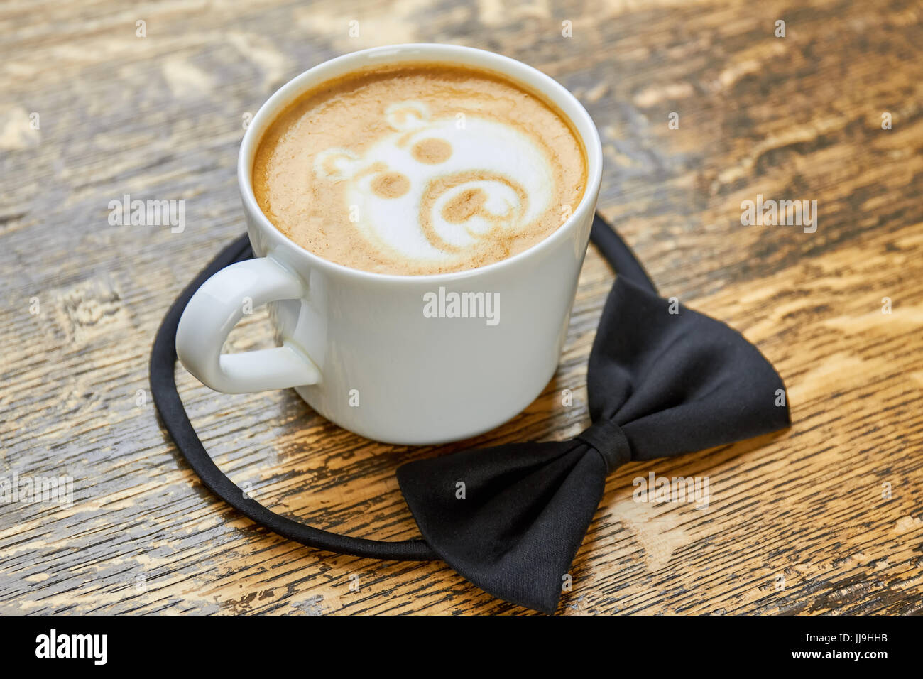 Coffee cup and bow tie Stock Photo - Alamy