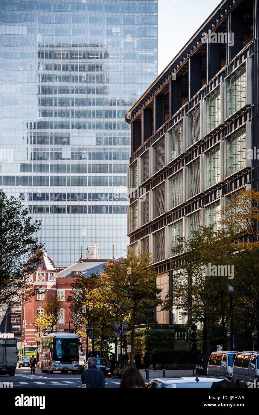 The iconic red walls of the Tokyo Station peek out from the surrounding ...