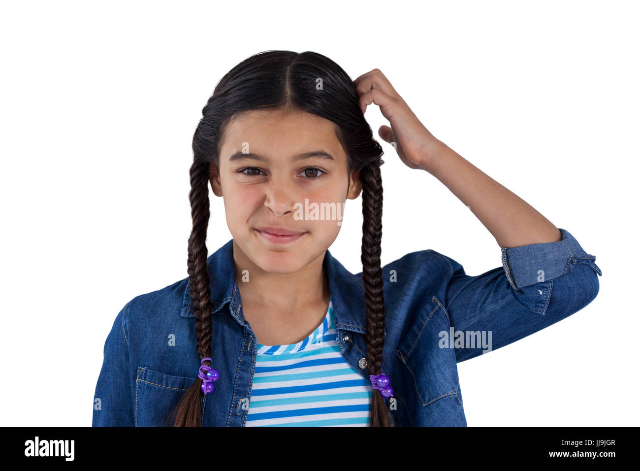 Confused girl standing against white background Stock Photo - Alamy