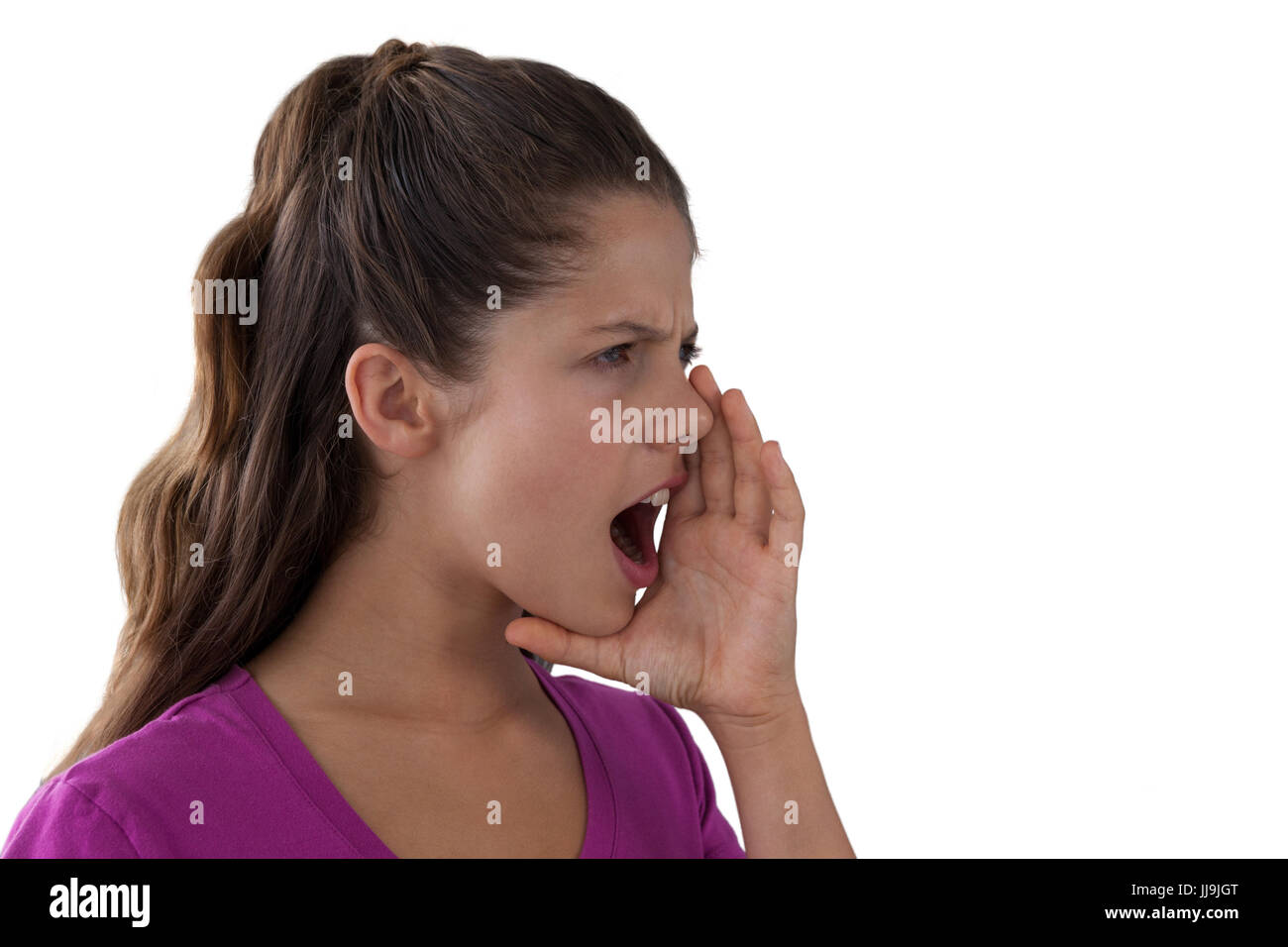 Angry girl screaming against a white background Stock Photo - Alamy