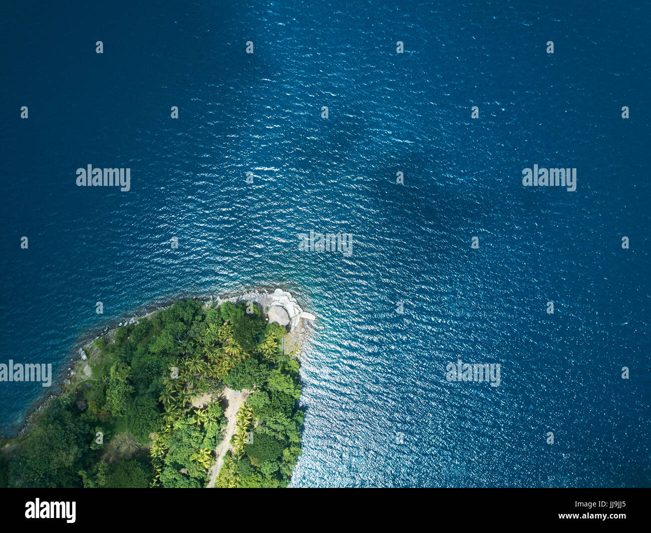 Small tropic island around blue sea water above view Stock Photo - Alamy
