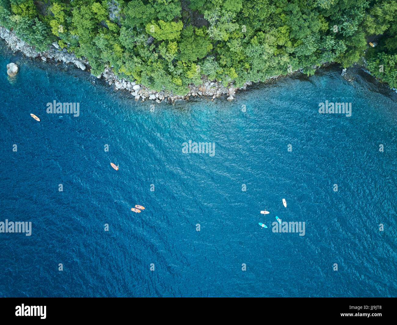 Kayaking adventure above view. Group of kayak in blue water Stock Photo ...