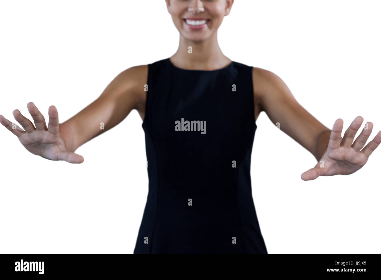 Mid section of happy young businesswoman using invisible interface ...