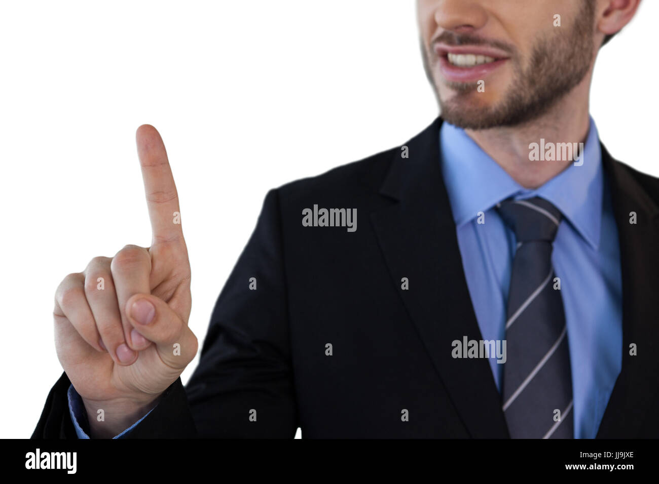 Mid section of smiling businessman touching invisible screen against ...