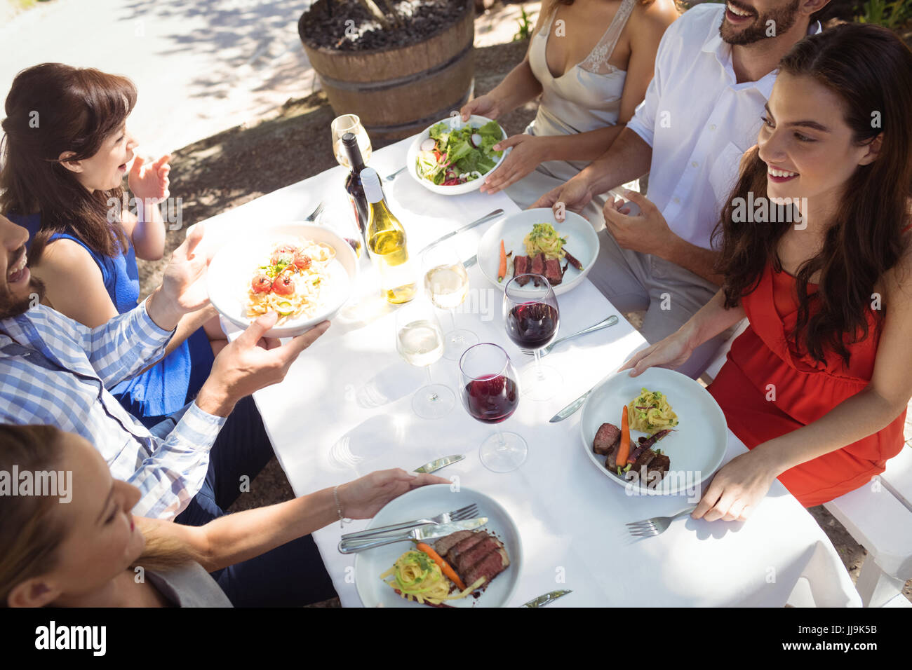 Group of friends having lunch in a restaurant Stock Photo - Alamy