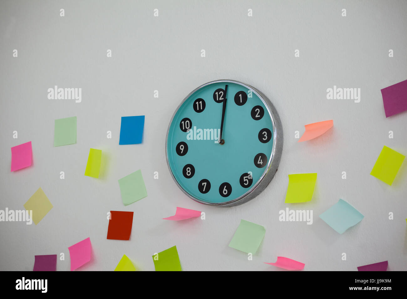 Colorful Sticky notes with clock on wall Stock Photo - Alamy