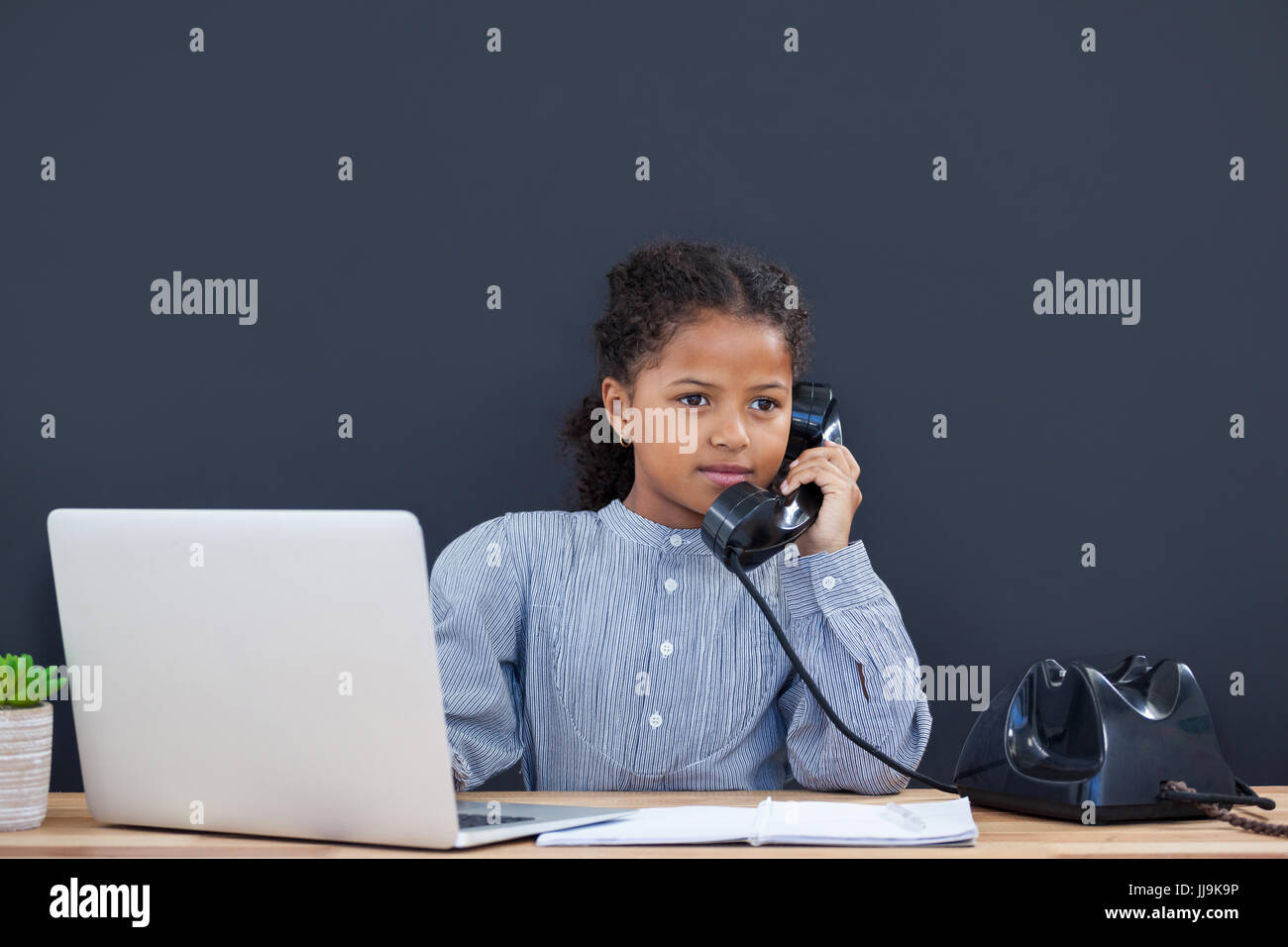 Girl using landline phone hi-res stock photography and images - Alamy