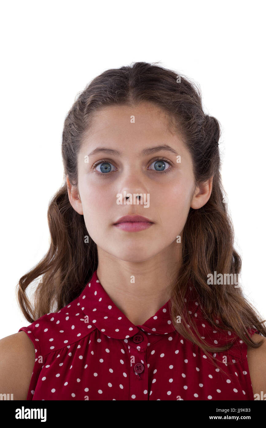 Confused girl standing against white background Stock Photo - Alamy
