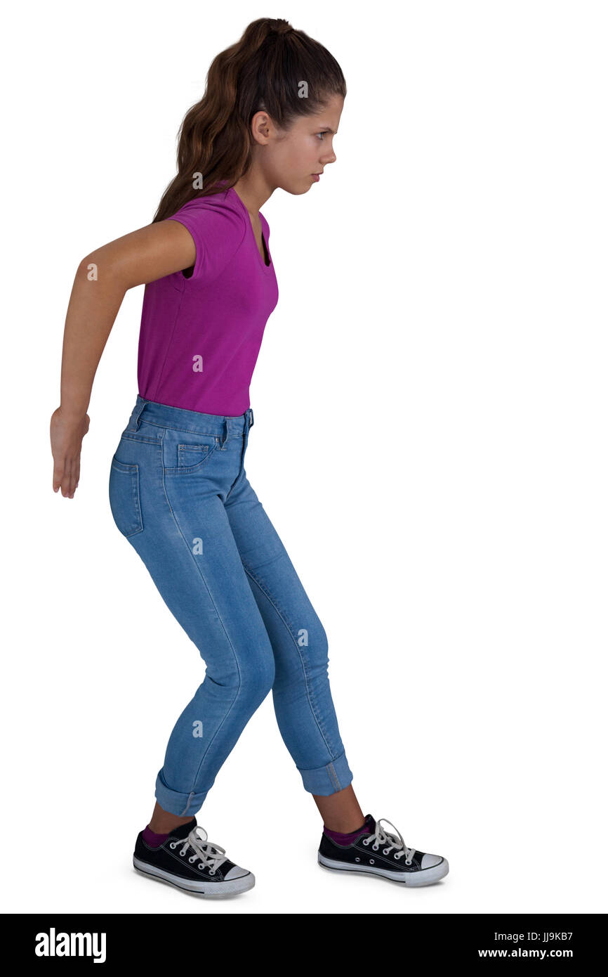 Side view of girl pushing behind against white background Stock Photo ...
