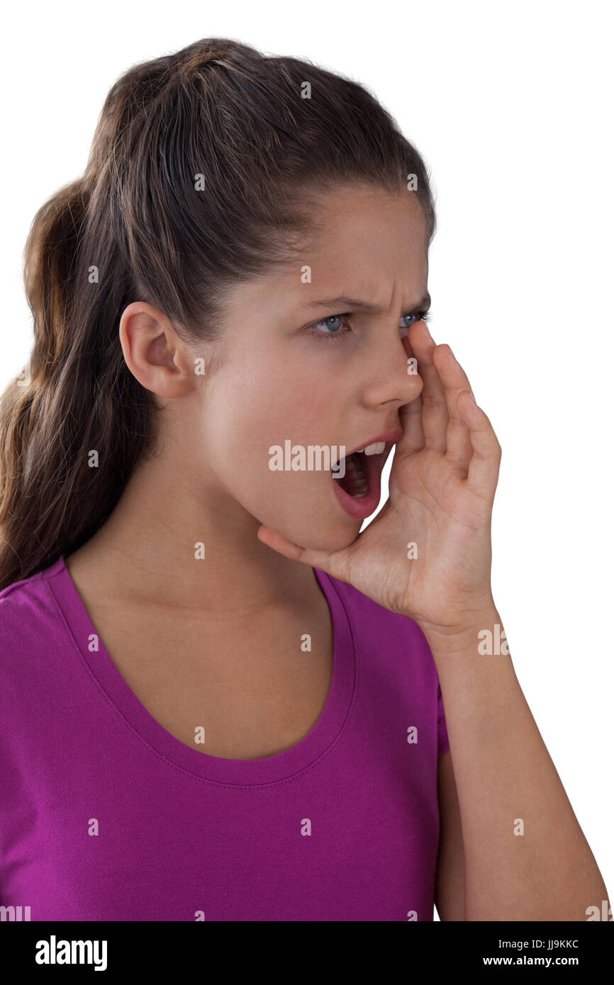 Angry girl screaming against a white background Stock Photo - Alamy