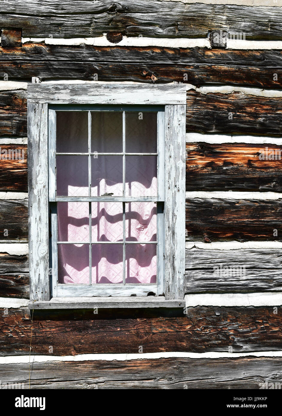 Detail of a window in a log cabin Stock Photo - Alamy
