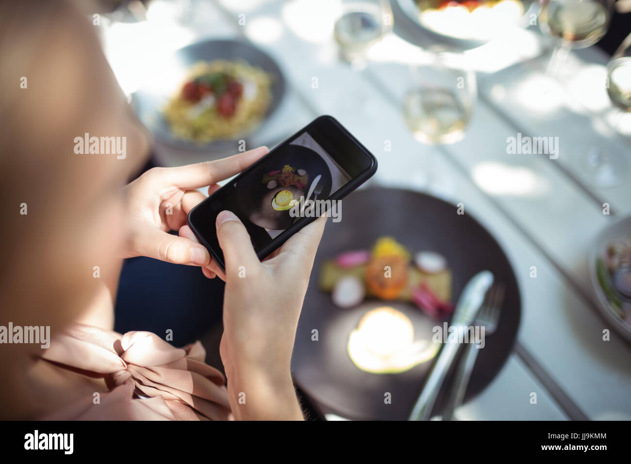 Taking picture of food in restaurant hi-res stock photography and ...