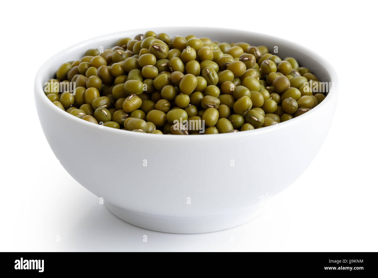 Dry mung beans in white ceramic bowl isolated on white Stock Photo - Alamy