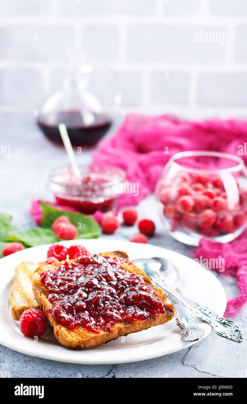toasts with raspberry jam on the plate Stock Photo - Alamy