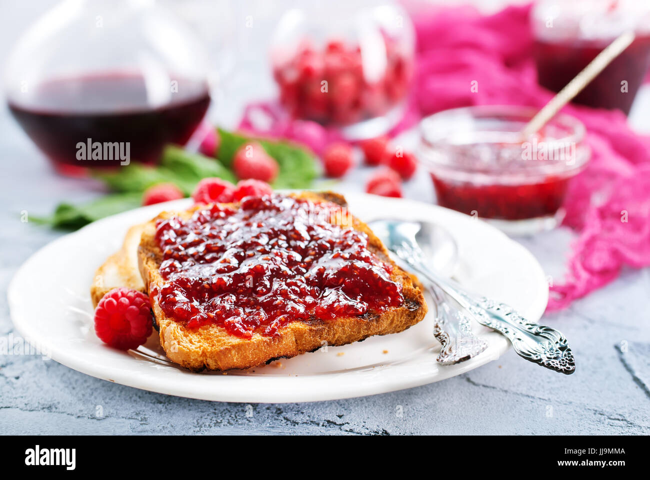 toasts with raspberry jam on the plate Stock Photo - Alamy