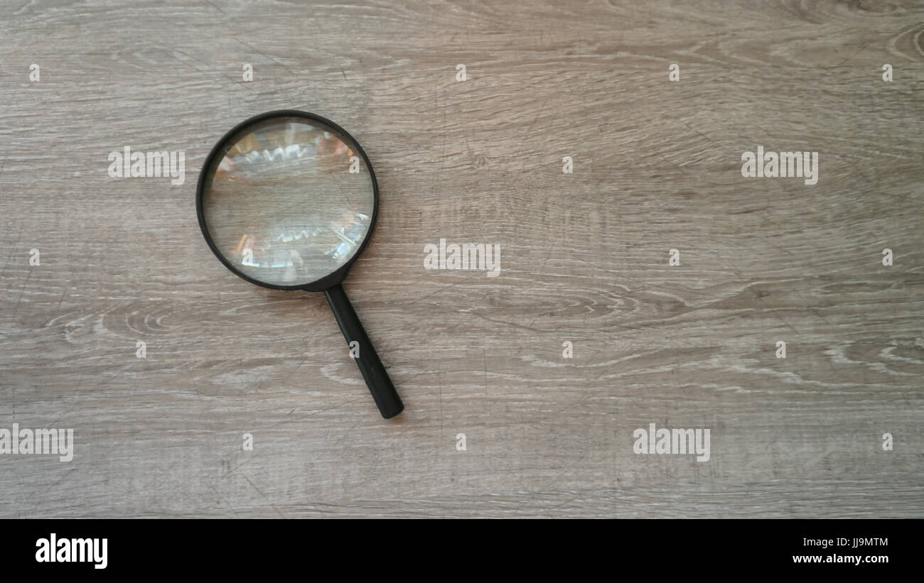 magnifying glass on the grey laminate background Stock Photo - Alamy